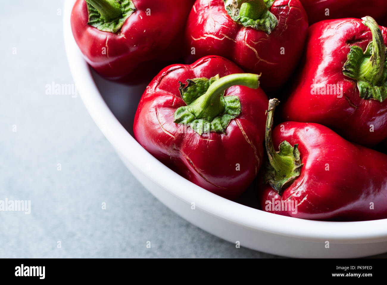 Whole Red Peppers in White Bowl. Close Up View. Organic Food Stock ...