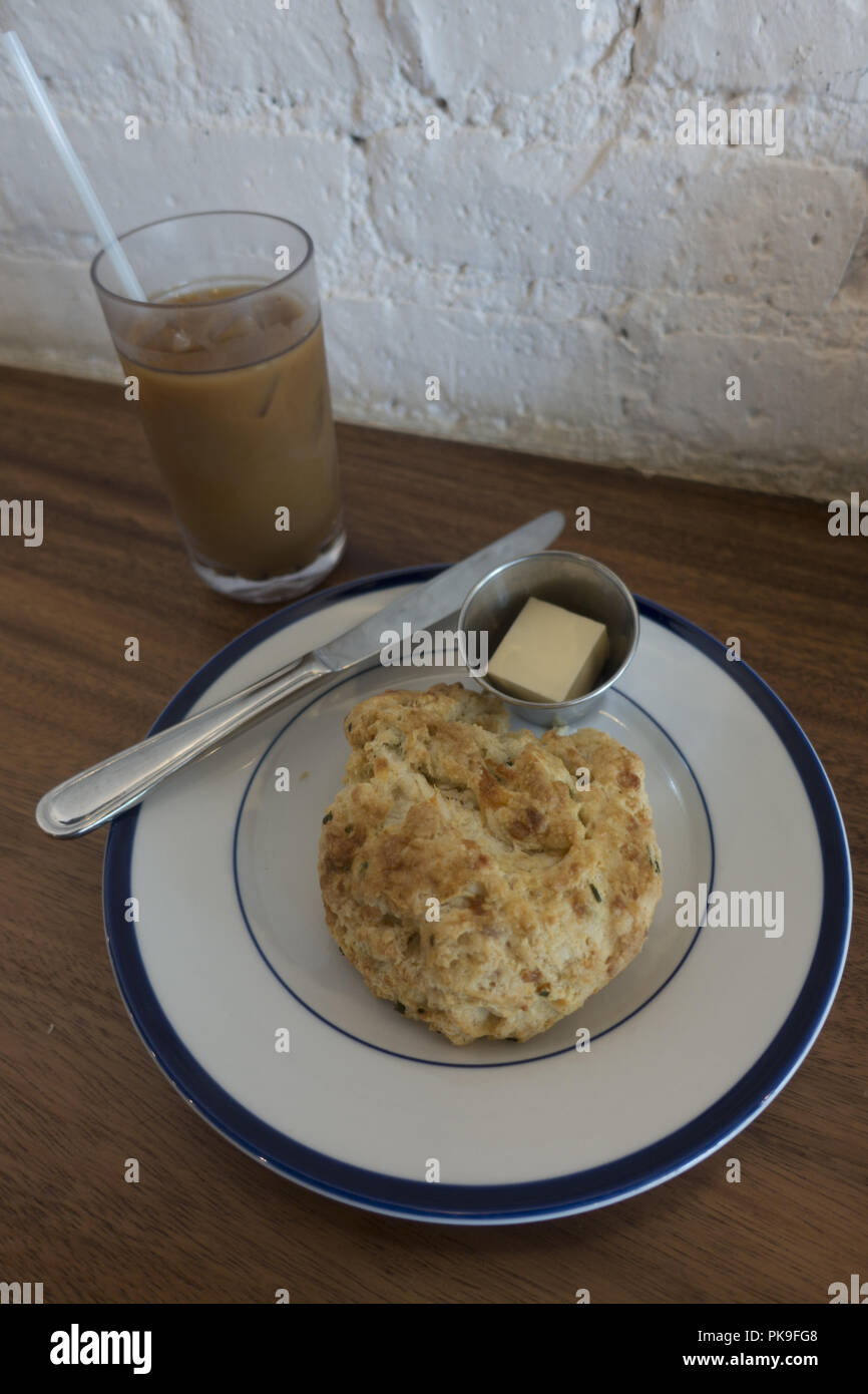 Biscuit, butter and iced coffee at a Brooklyn cafe, New York City Stock ...