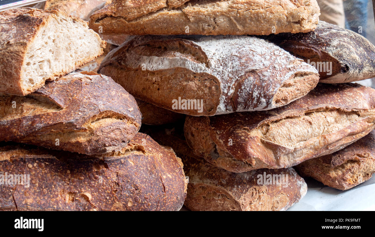 a stack of traditional breads in the bakery Stock Photo - Alamy