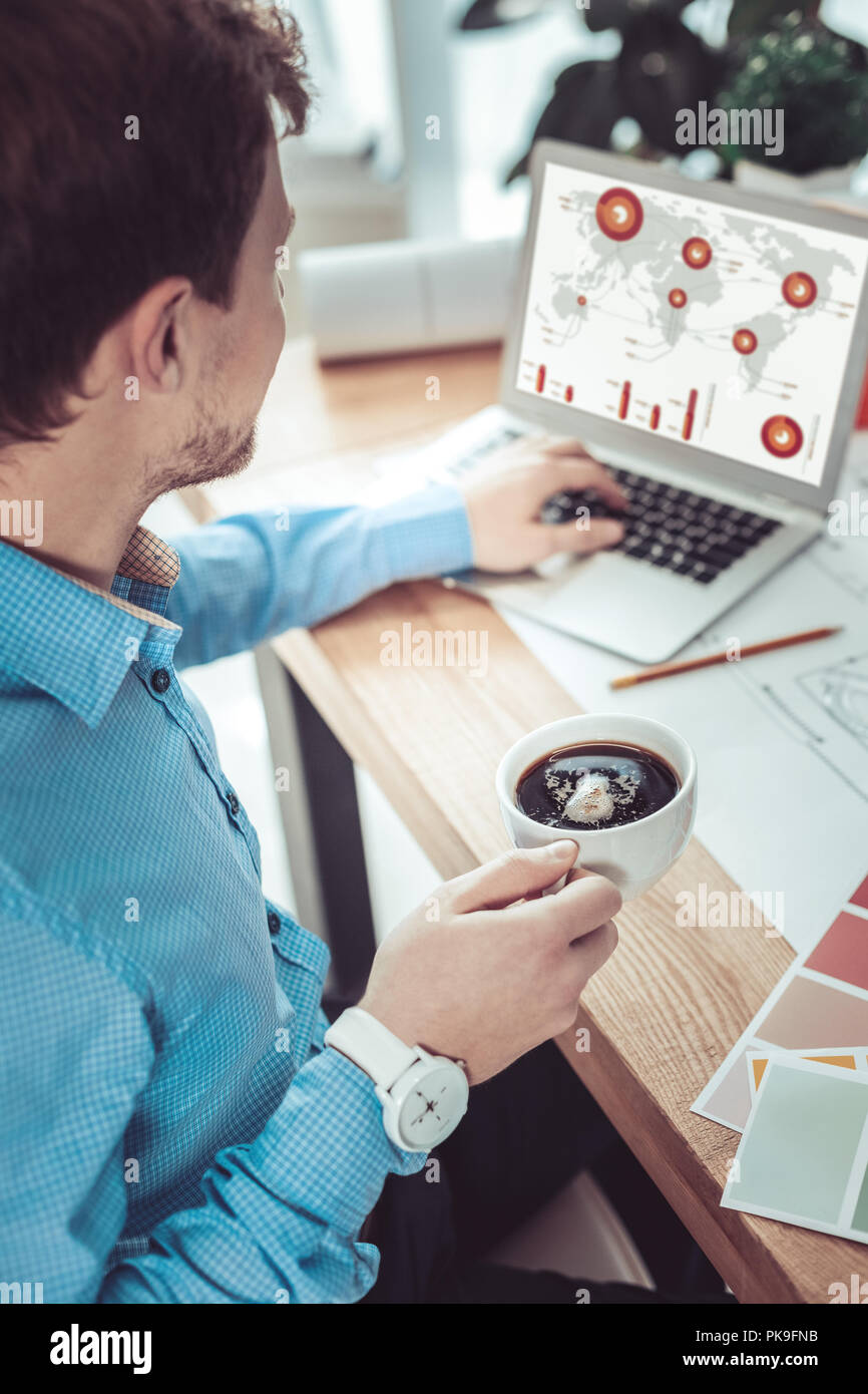 Close up of serious man that analyzing diagram Stock Photo - Alamy