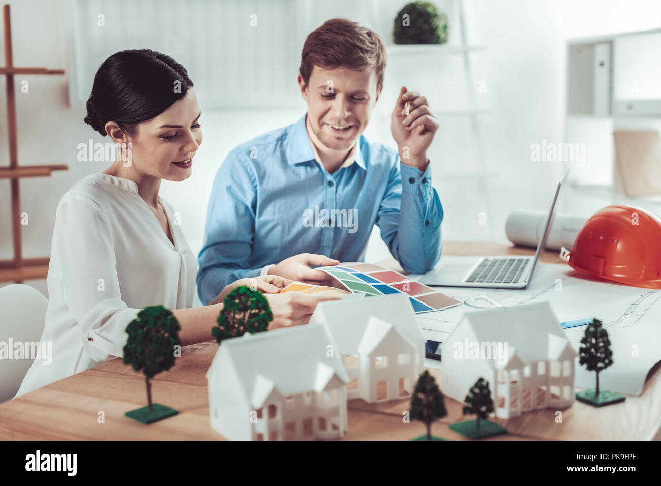 Amazing brunette woman looking at color palette Stock Photo - Alamy