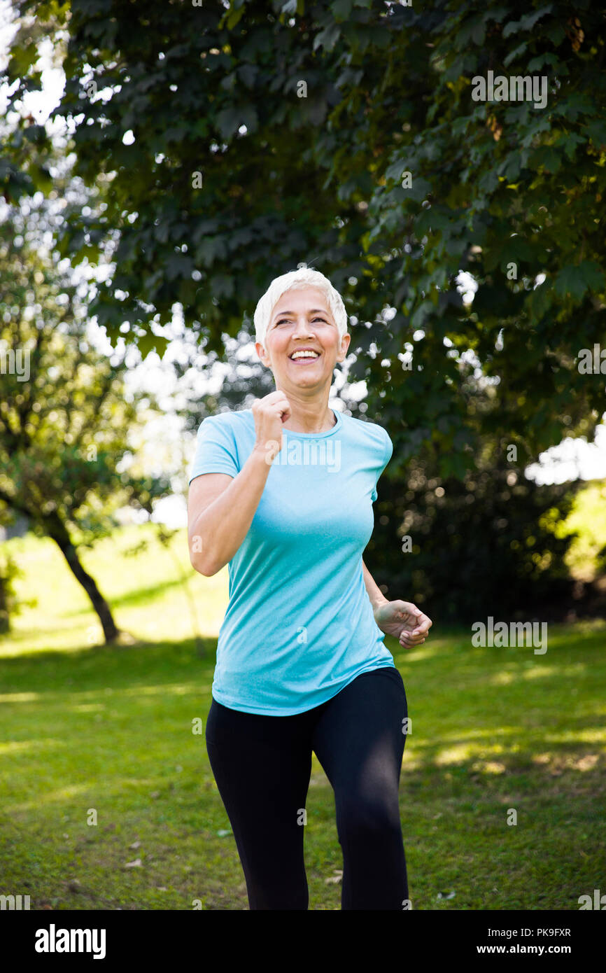 Old lady jogging hi-res stock photography and images - Alamy