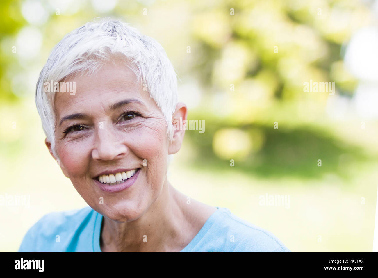Optimistic senior woman hi-res stock photography and images - Alamy