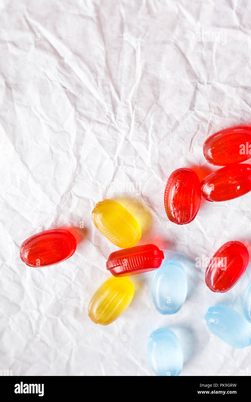 colorful candies on paper background Stock Photo - Alamy