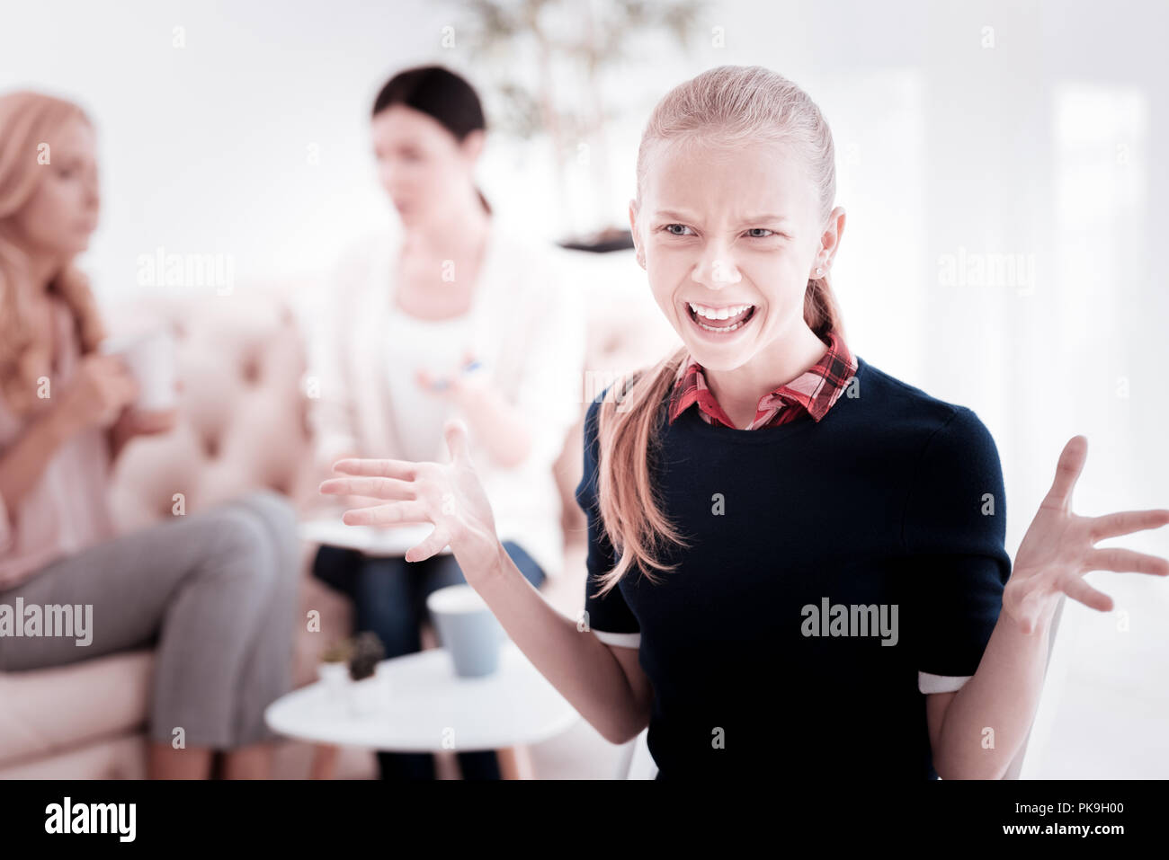 Emotional teenage girl shouting and feeling angry Stock Photo - Alamy