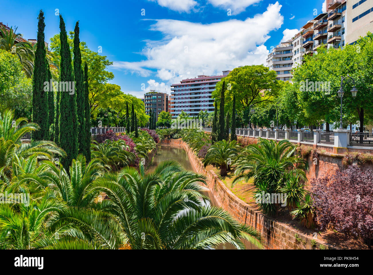 Citycape with water canal stream and park in Palma de Majorca, Spain ...