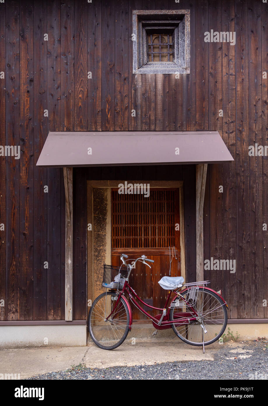 Bicycle parked in front of a funaya house, Kyoto prefecture, Ine, Japan ...