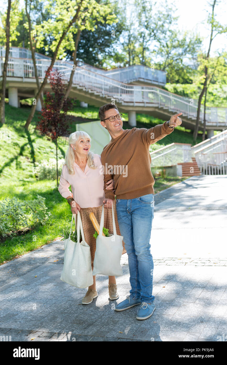 Pleased blonde woman being surprised with seen Stock Photo - Alamy