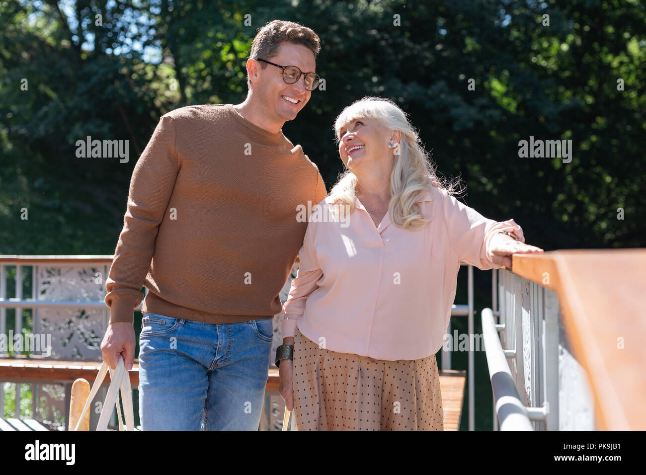Woman supporting young man outdoors hi-res stock photography and images ...