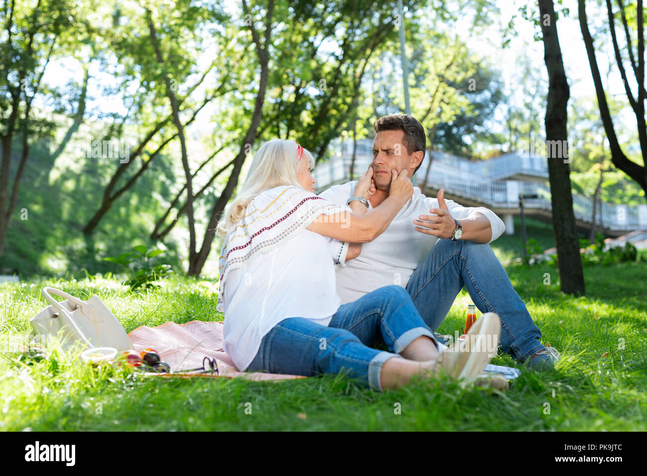 Serious brunette man talking to his mom Stock Photo - Alamy