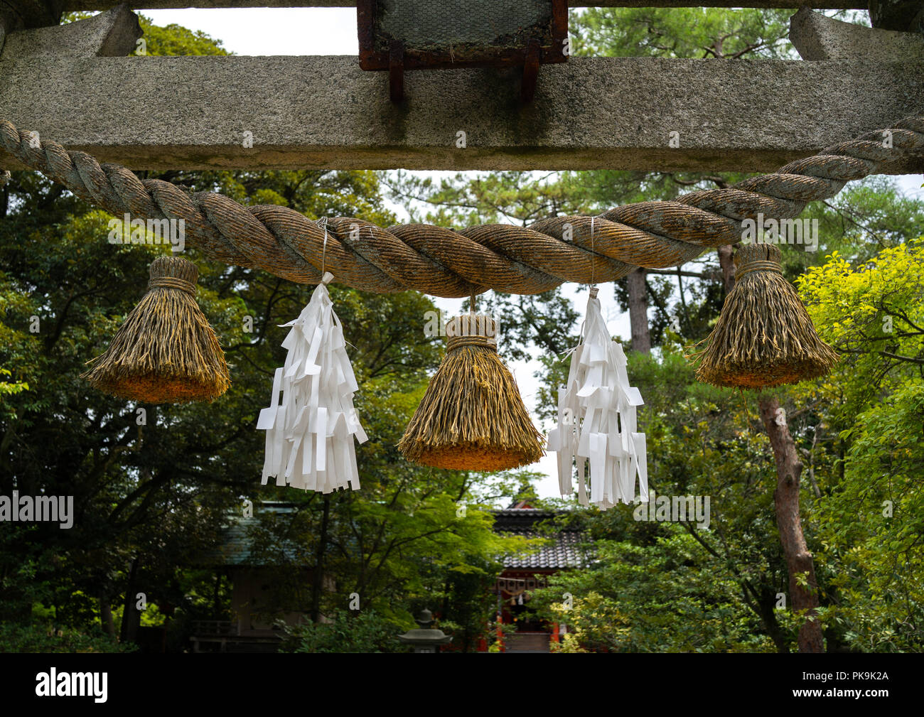 Torii gate braided rope and papers decorations in Kenroku-en garden ...