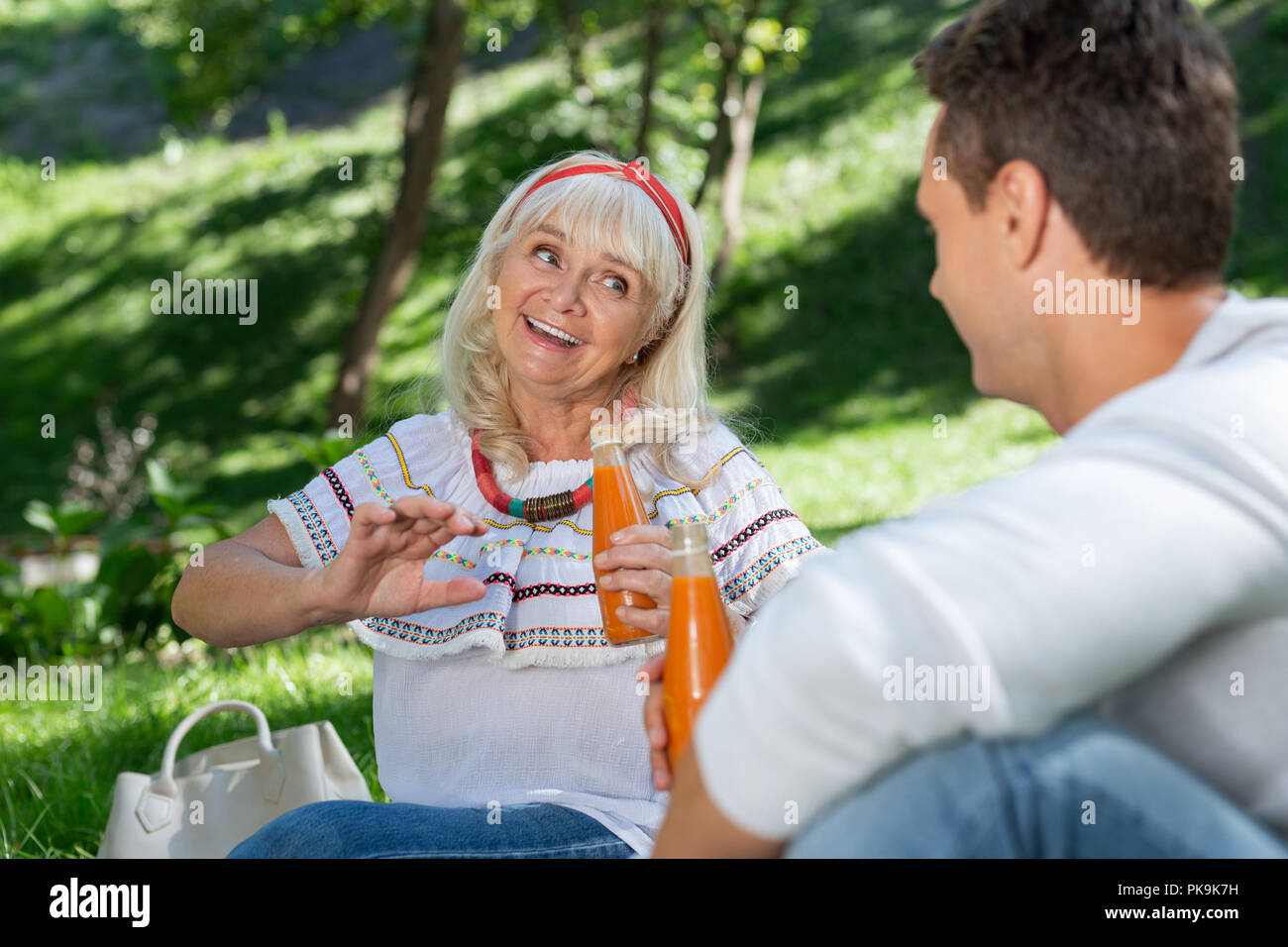Portrait of pleased female person while talking Stock Photo - Alamy