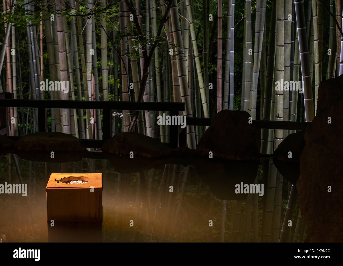 Bucket next to a bamboo forest hot spring in Takefue ryokan, Kumamoto ...