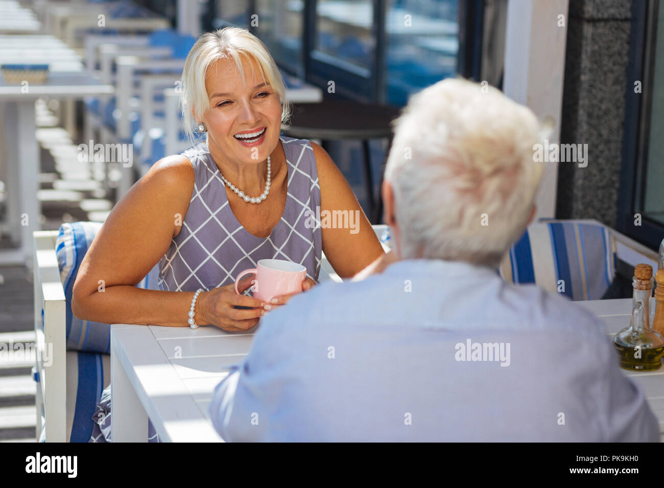 Happy delighted woman being in a perfect mood Stock Photo - Alamy
