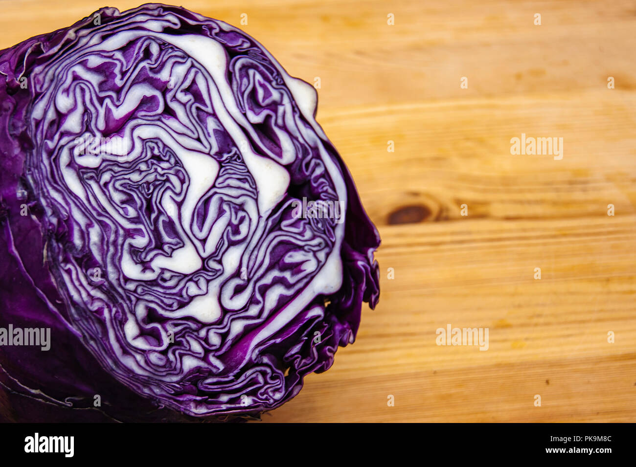 Cut red cabbage on cutting board. Culinary still life Stock Photo - Alamy