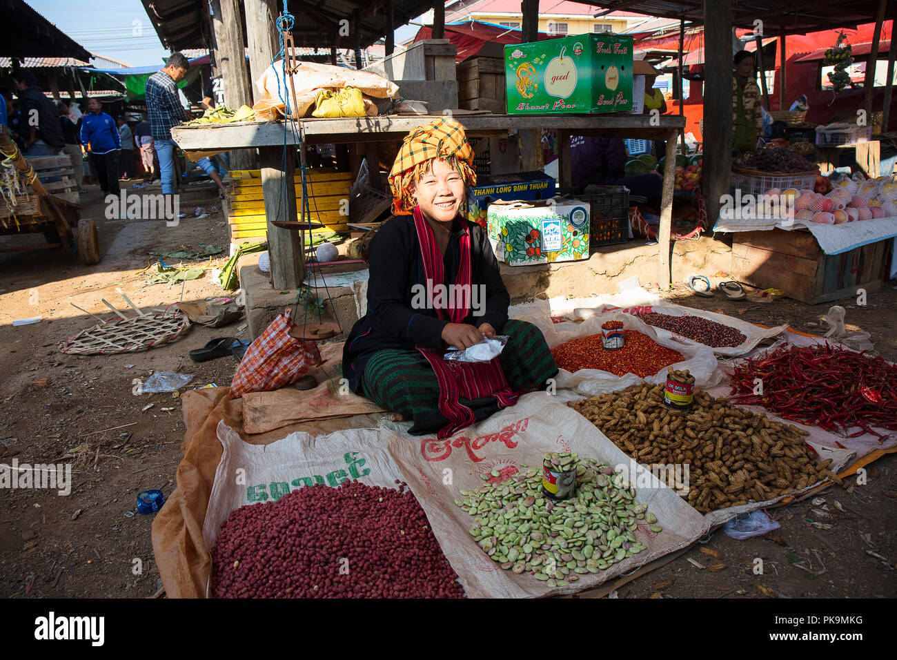 A local Burmese selling spices and dry fruits in a stand at the Phaung ...