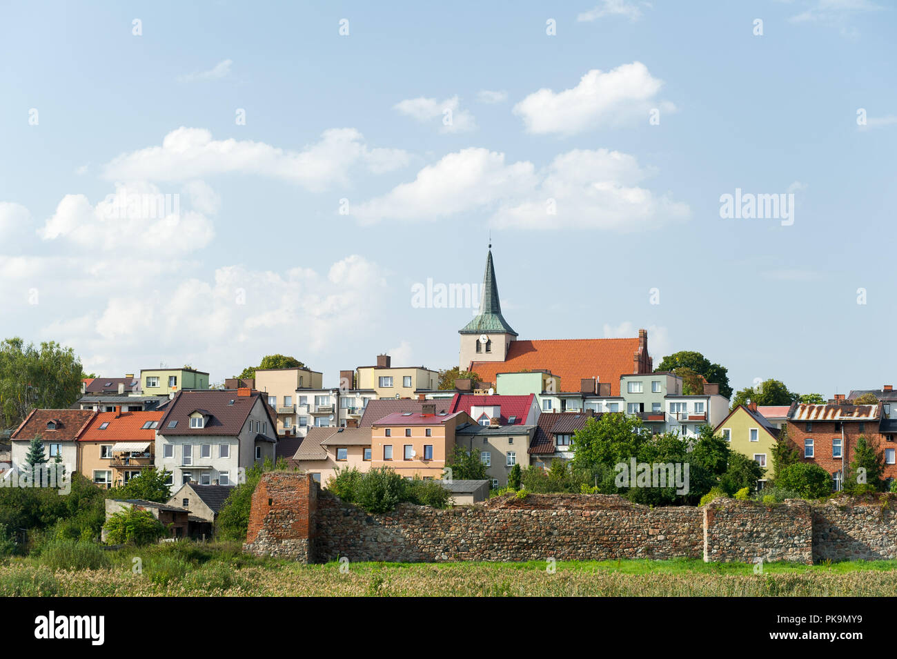 Fragments of XIV century stone walls, old town and church of St ...