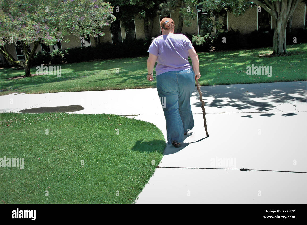 Heavy woman with real walking stick needed due to weight related ...