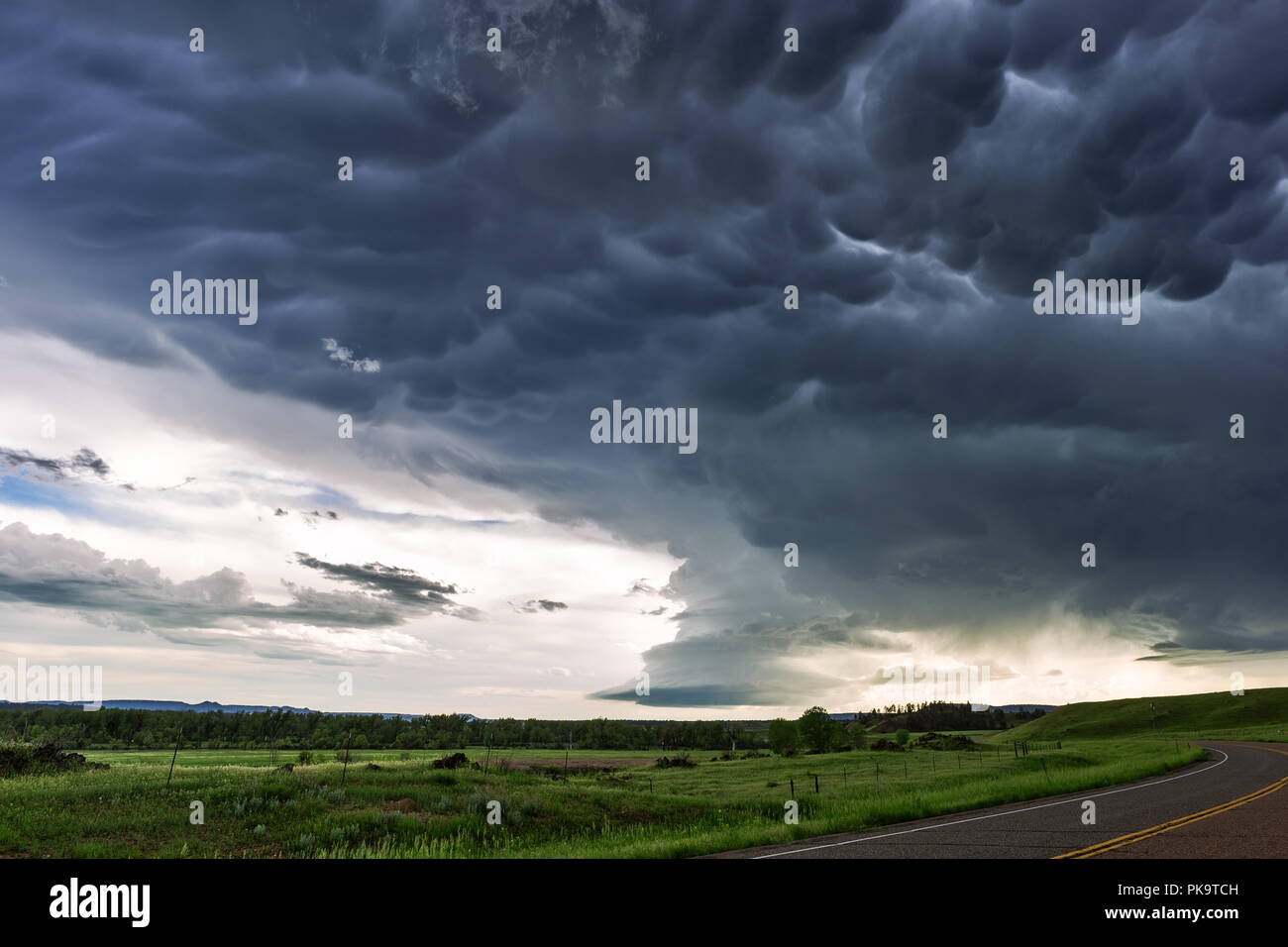 A supercell thunderstorm with dramatic mammatus clouds in Montana near ...