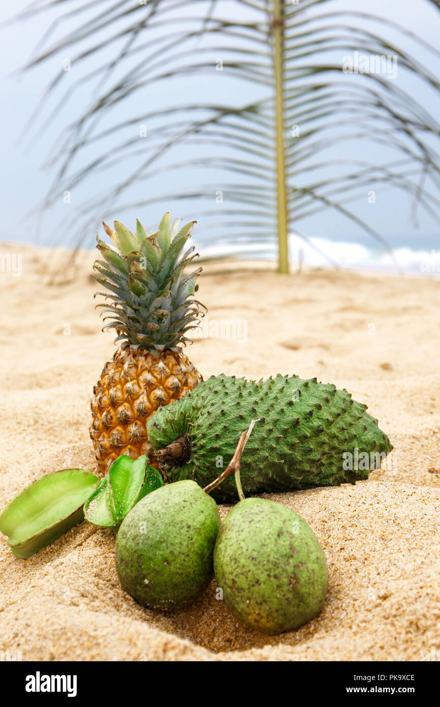 Exotic fruits on the sand near the ocean Stock Photo - Alamy
