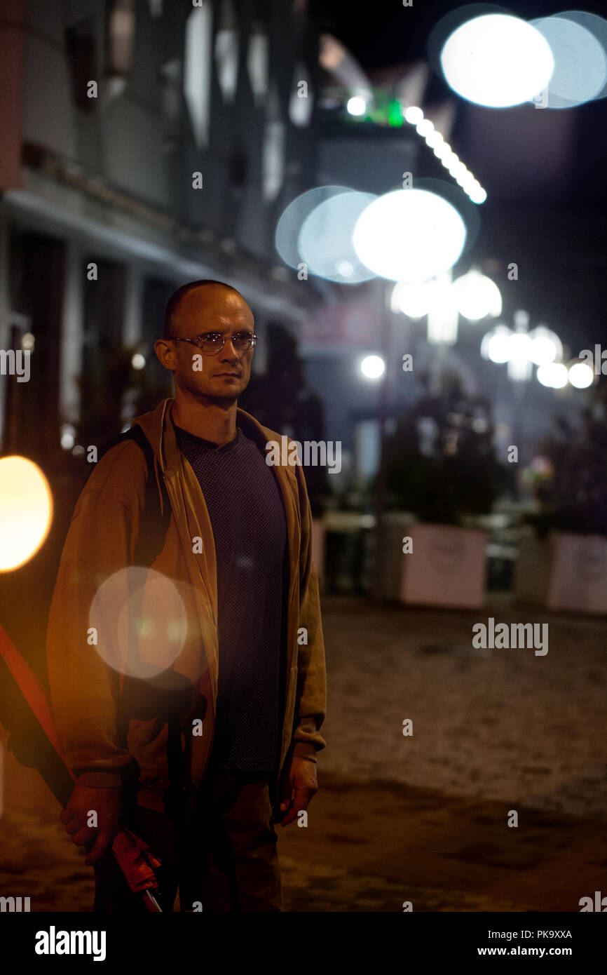 man in the night city Stock Photo - Alamy
