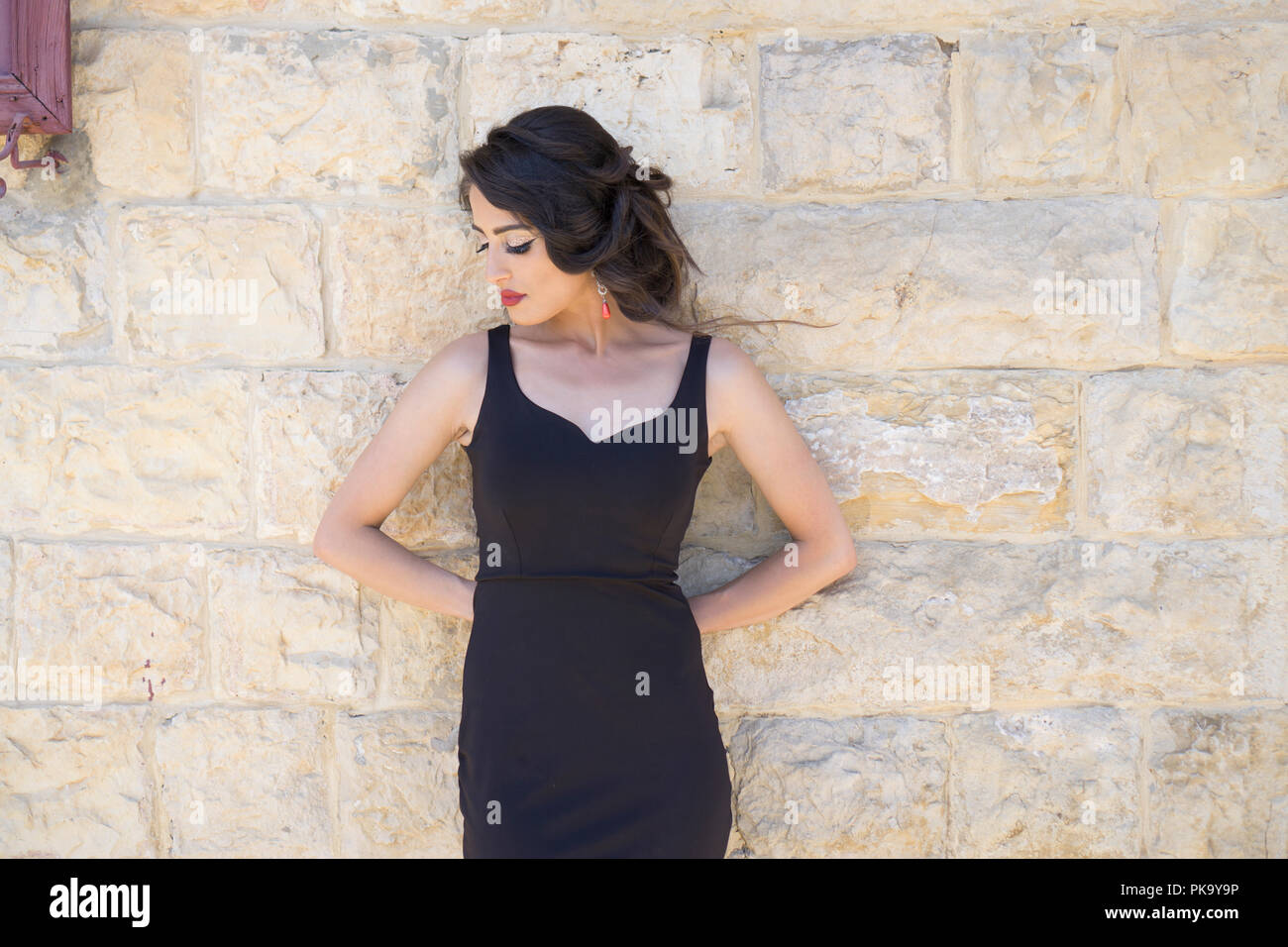 Sad woman standing outdoors Stock Photo - Alamy