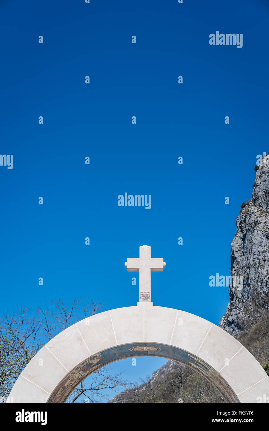 Cross on top of arched gates with beautiful mosaics at the entrance to ...