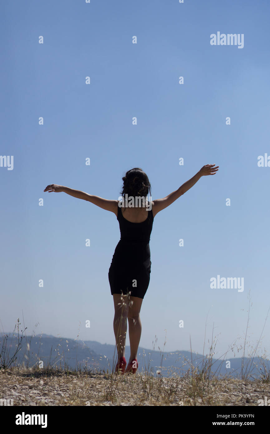 Arms behind back woman hi-res stock photography and images - Alamy