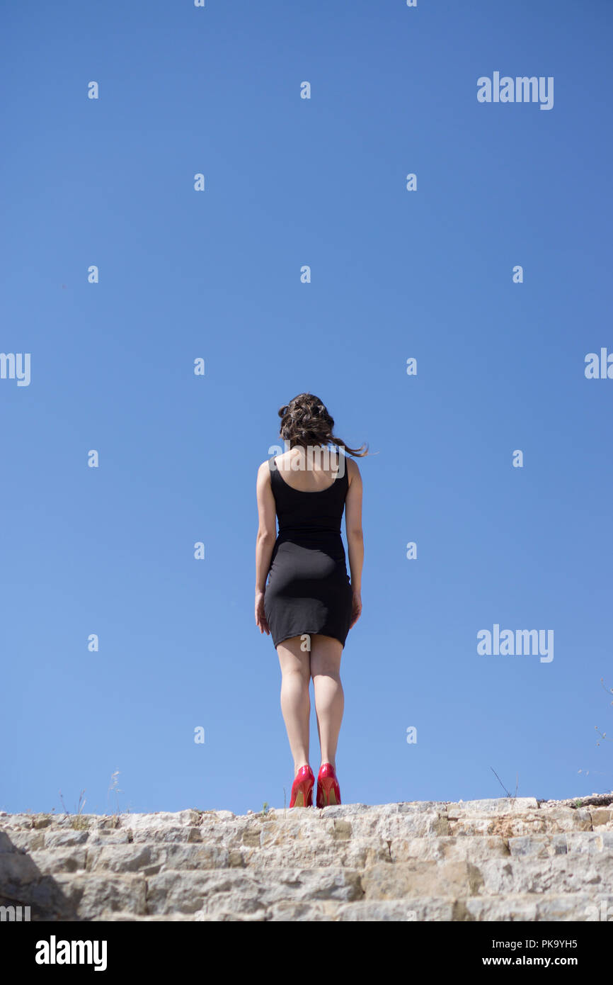 Woman standing on top of stairs hi-res stock photography and images - Alamy