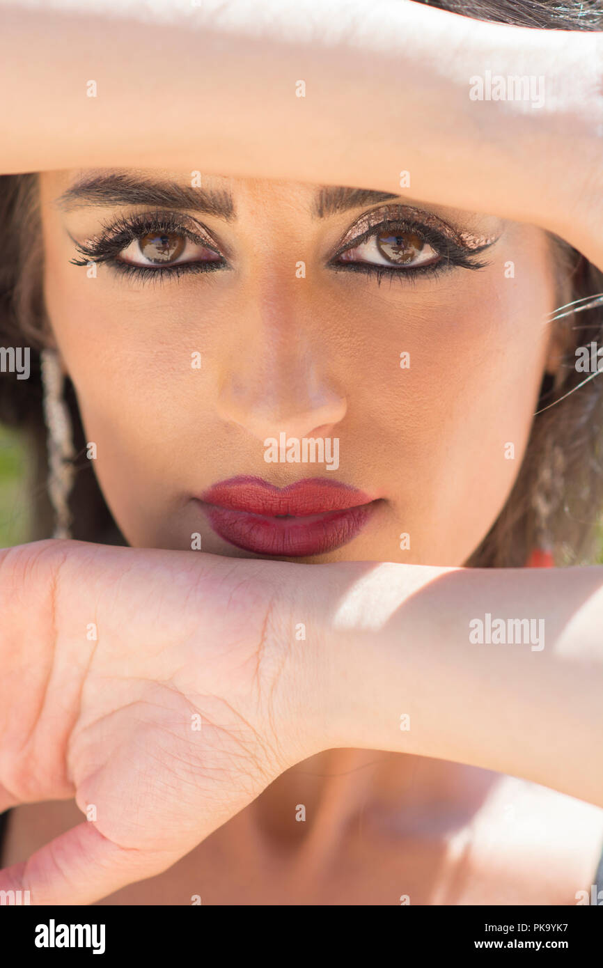 Beautiful woman hiding face with hands Stock Photo - Alamy