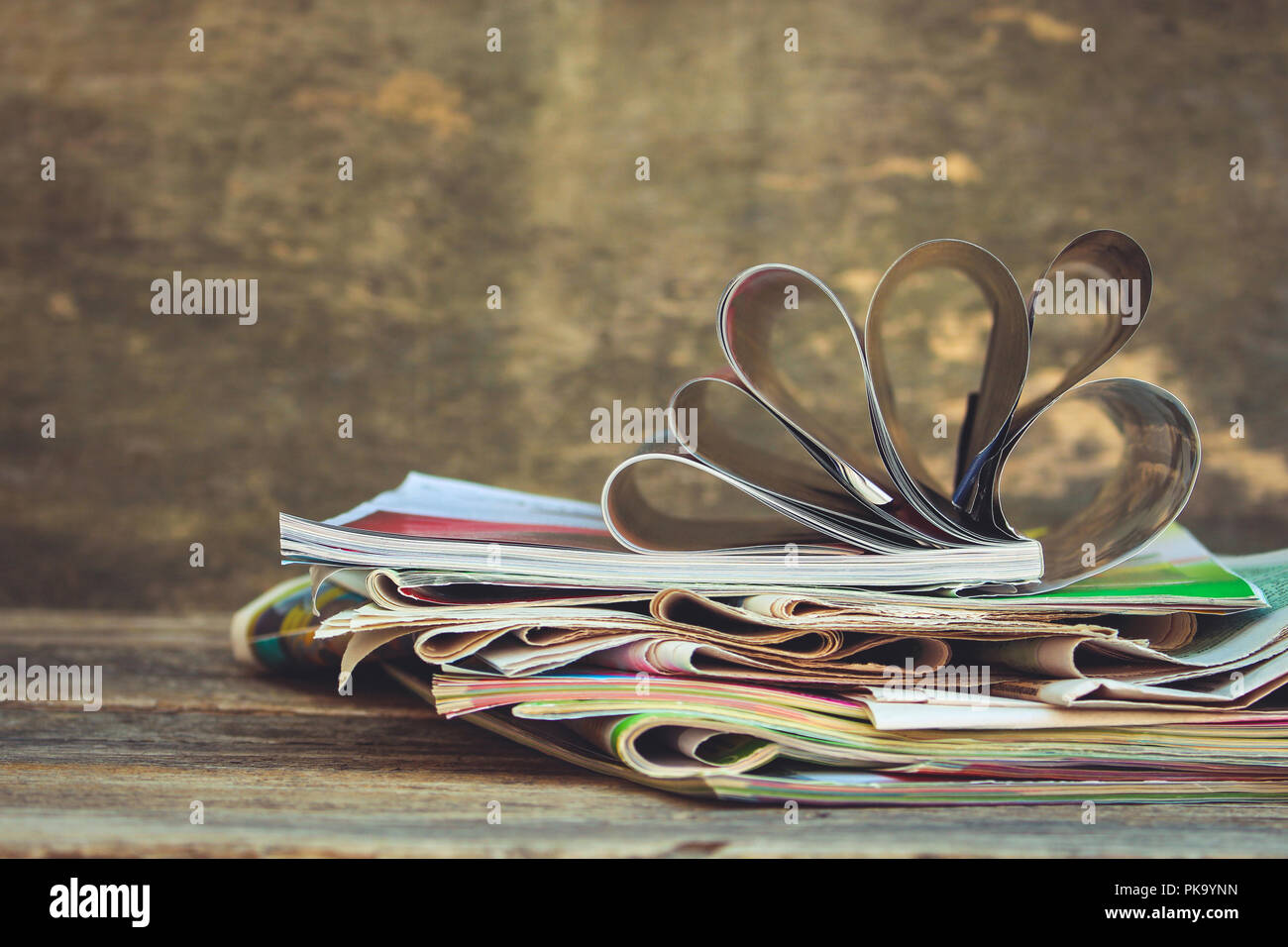 Newspapers and magazines on old wood background. Toned image Stock ...