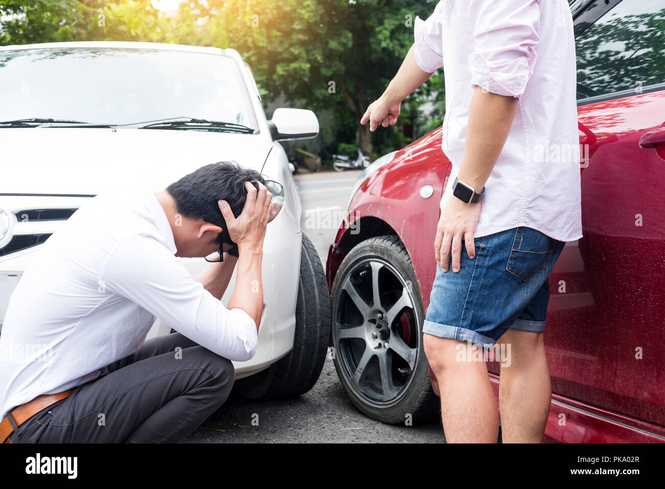 Two men arguing after a car accident Traffic Collision on the road ...