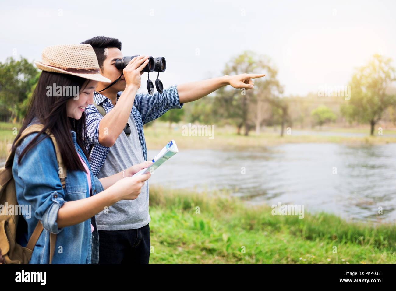 Outdoor shot of happy young loving couple hikers at valley of the ...