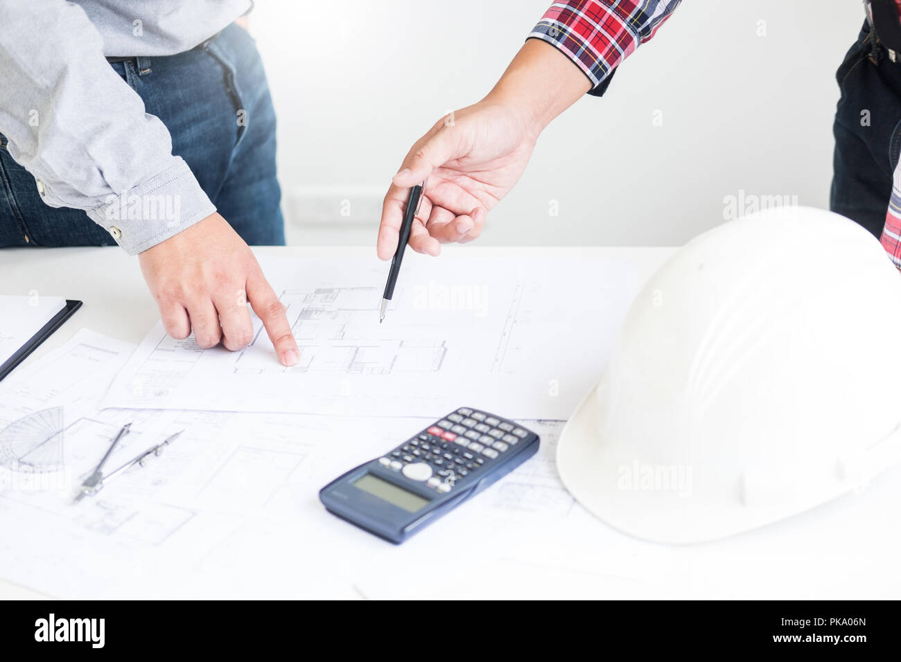 Close-up Of Person's engineer Hand Drawing Plan On Blue Print with ...