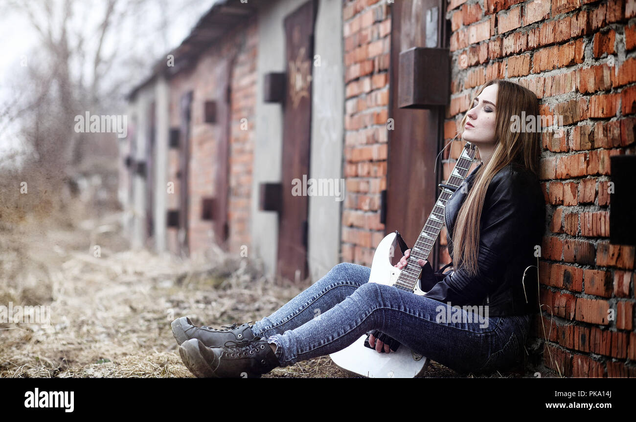 Beautiful young girl rocker with electric guitar. A rock musicia Stock ...