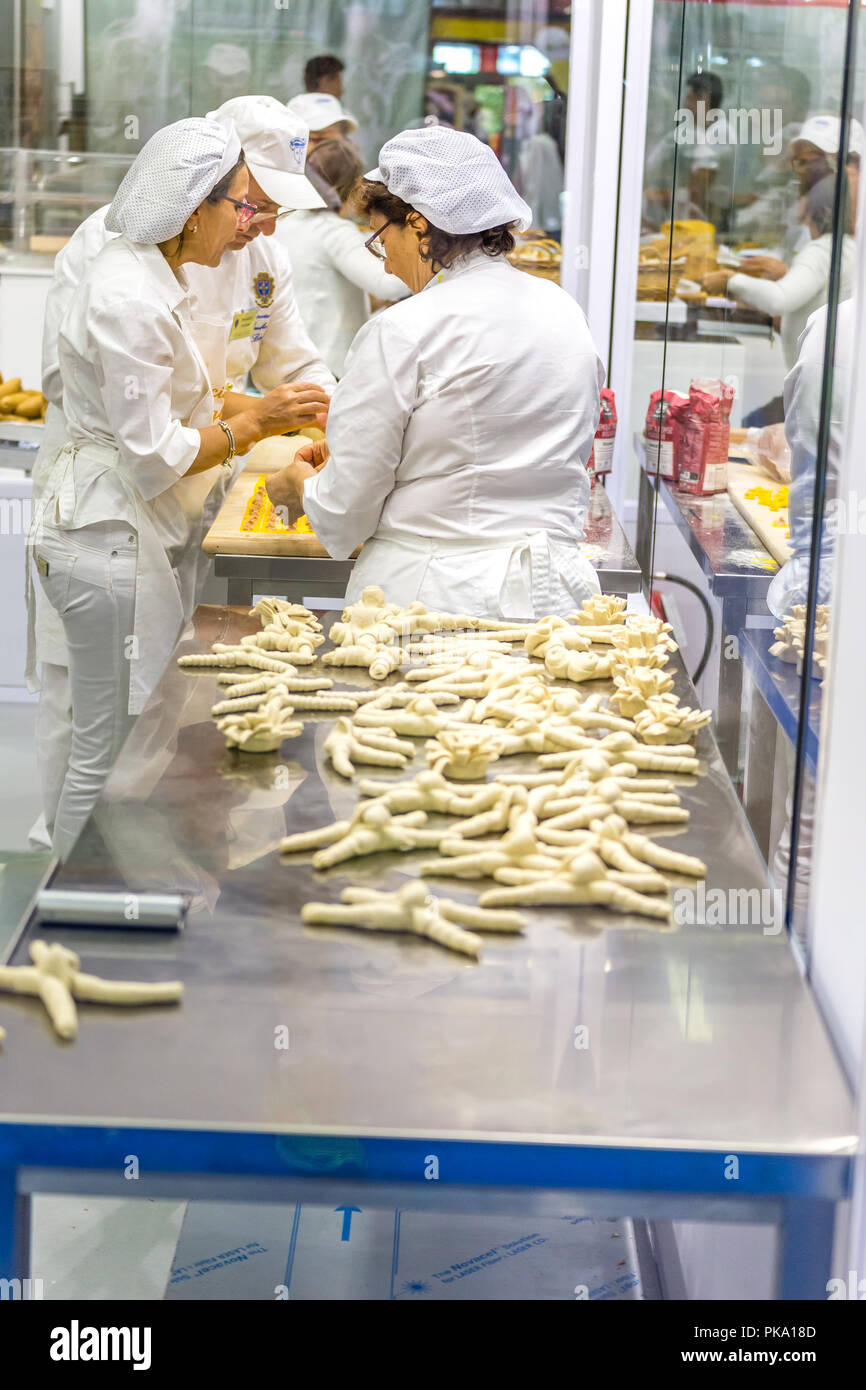 BOLOGNA (ITALY), SEPTEMBER 10, 2018: booth presenter are preparing ...
