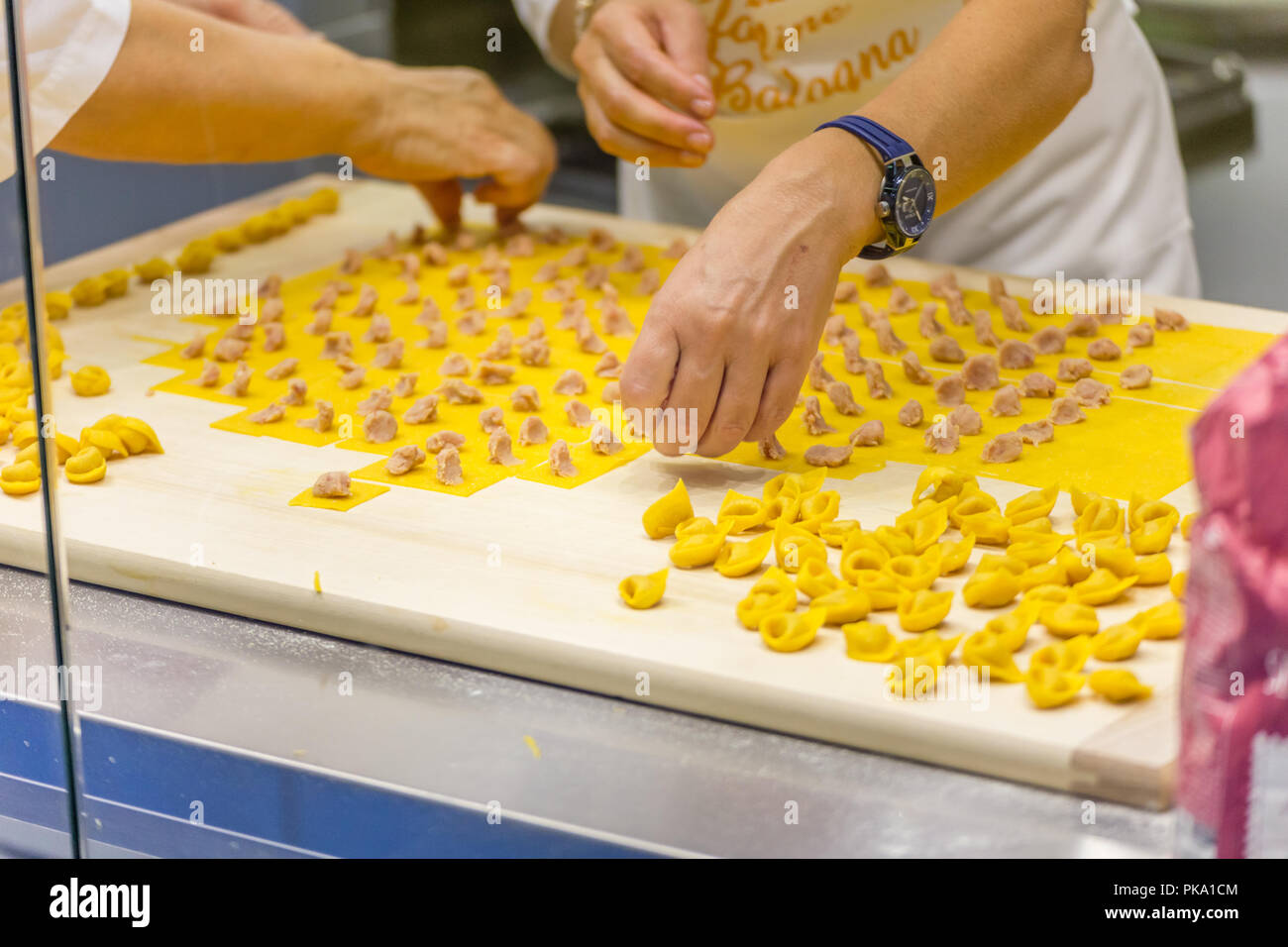 BOLOGNA (ITALY), SEPTEMBER 10, 2018: booth presenter is preparing ...