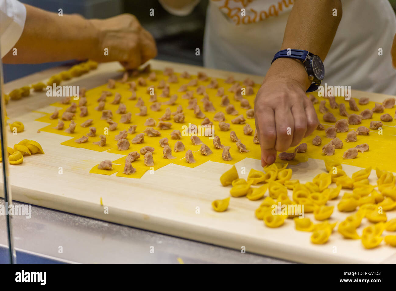 BOLOGNA (ITALY), SEPTEMBER 10, 2018: booth presenter is preparing ...