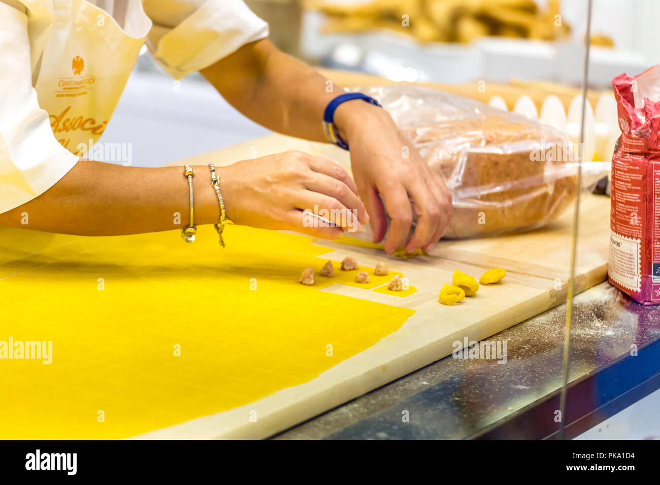 BOLOGNA (ITALY), SEPTEMBER 10, 2018: booth presenter is preparing ...
