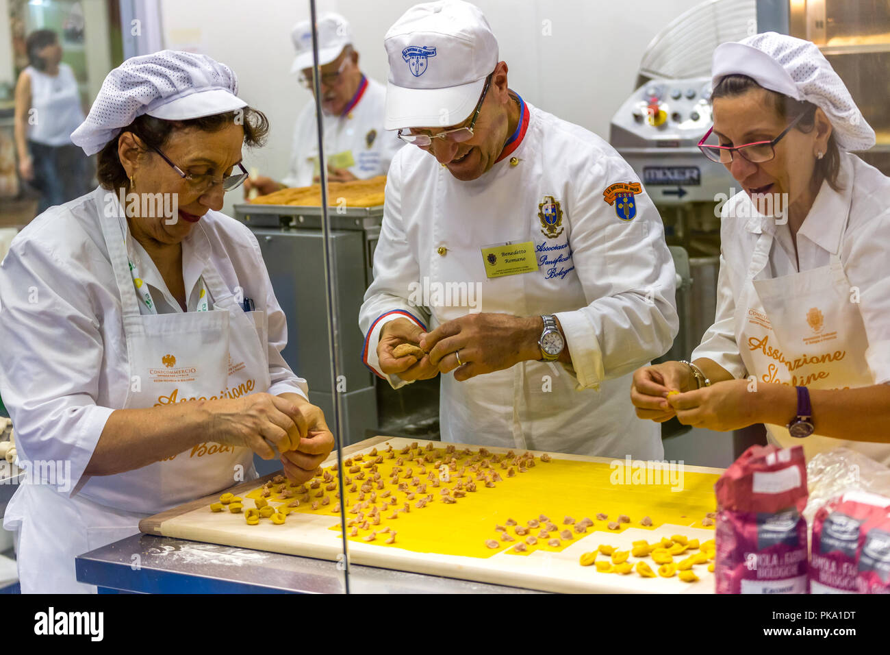 BOLOGNA (ITALY), SEPTEMBER 10, 2018: booth presenters are preparing ...