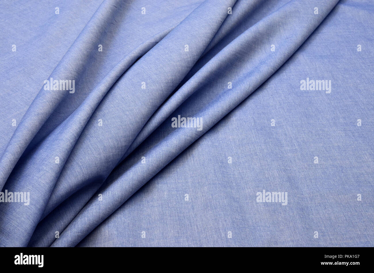 Cotton fabric, shirts, light blue denim color Stock Photo - Alamy