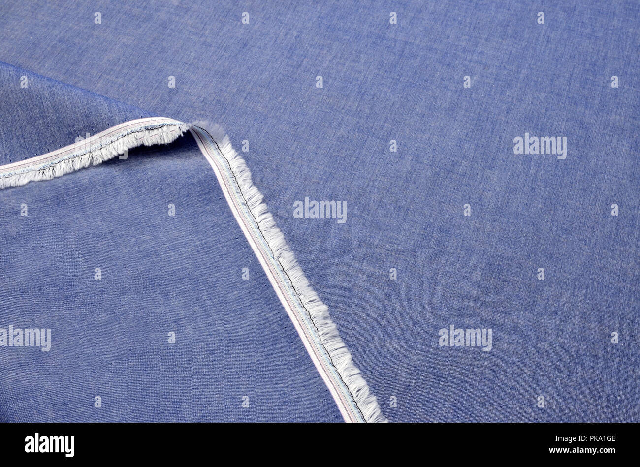 Cotton fabric, shirts, light blue denim color Stock Photo - Alamy