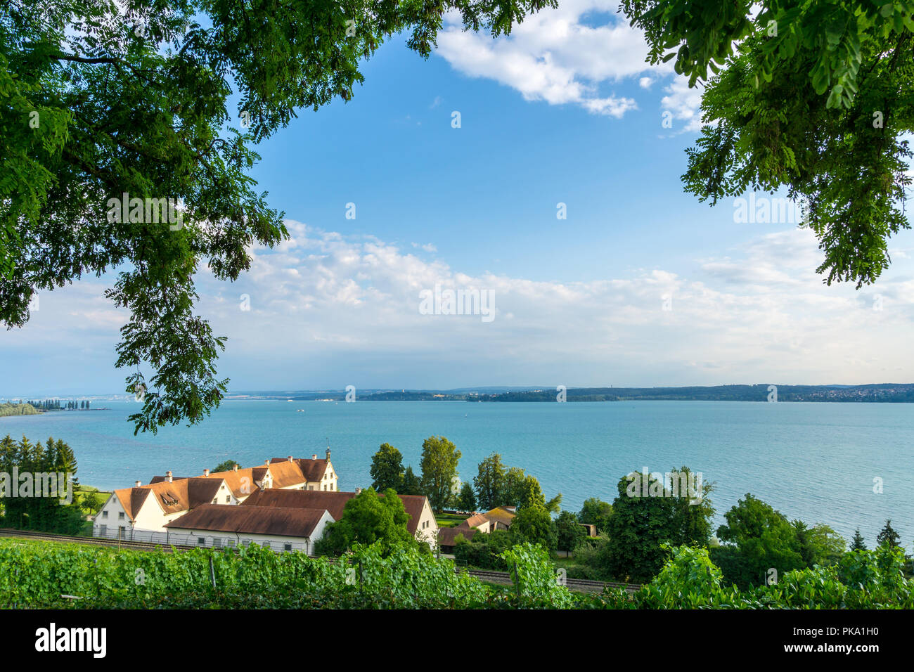 Germany, Railroad with houses and lake constance behind Stock Photo - Alamy