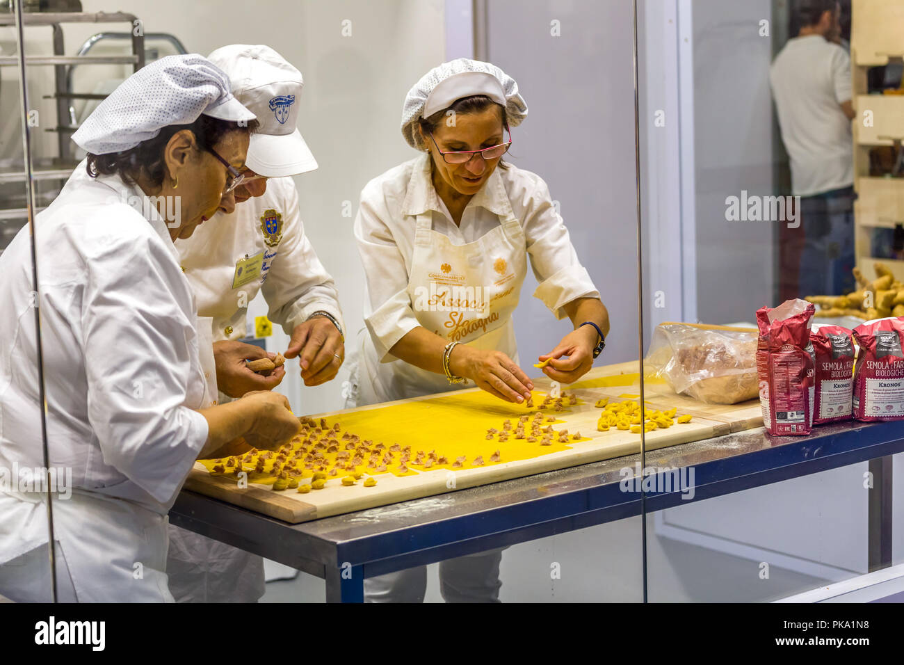 BOLOGNA (ITALY), SEPTEMBER 10, 2018: booth presenters are preparing ...