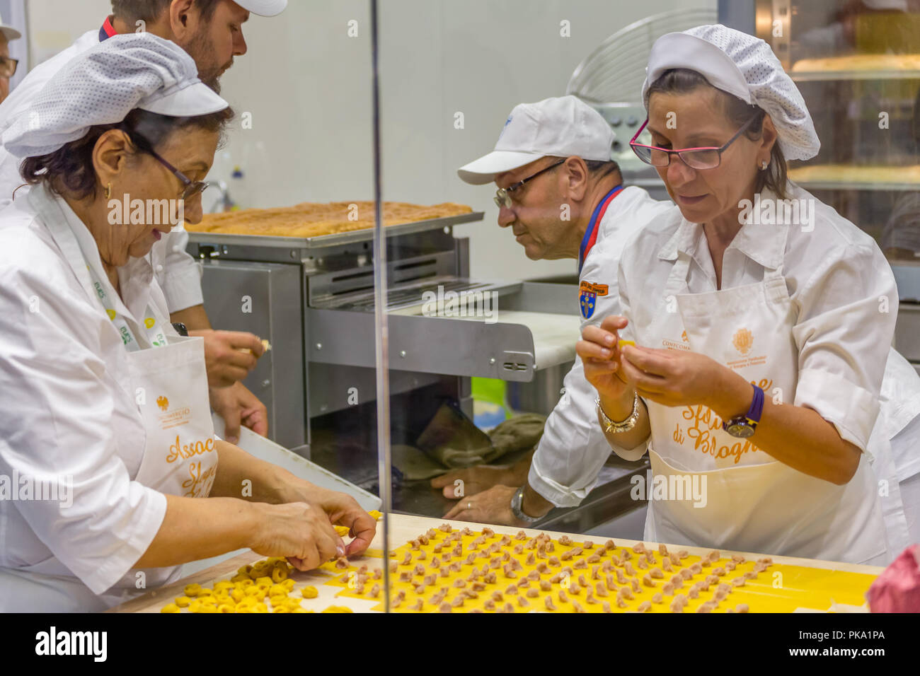BOLOGNA (ITALY), SEPTEMBER 10, 2018: booth presenters are preparing ...
