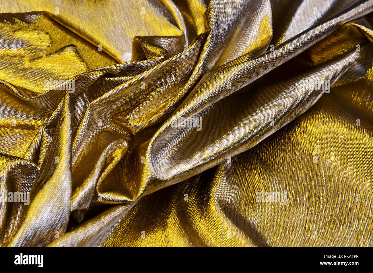 Fabric of golden color Stock Photo - Alamy