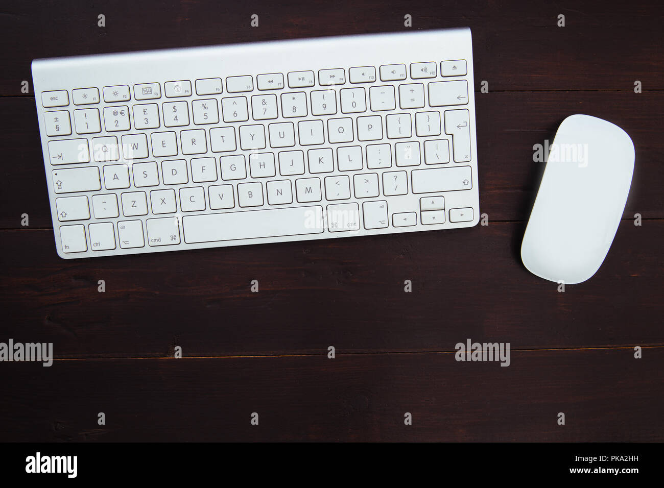 Computer keyboard and mouse on wood office desk workspace Stock Photo ...