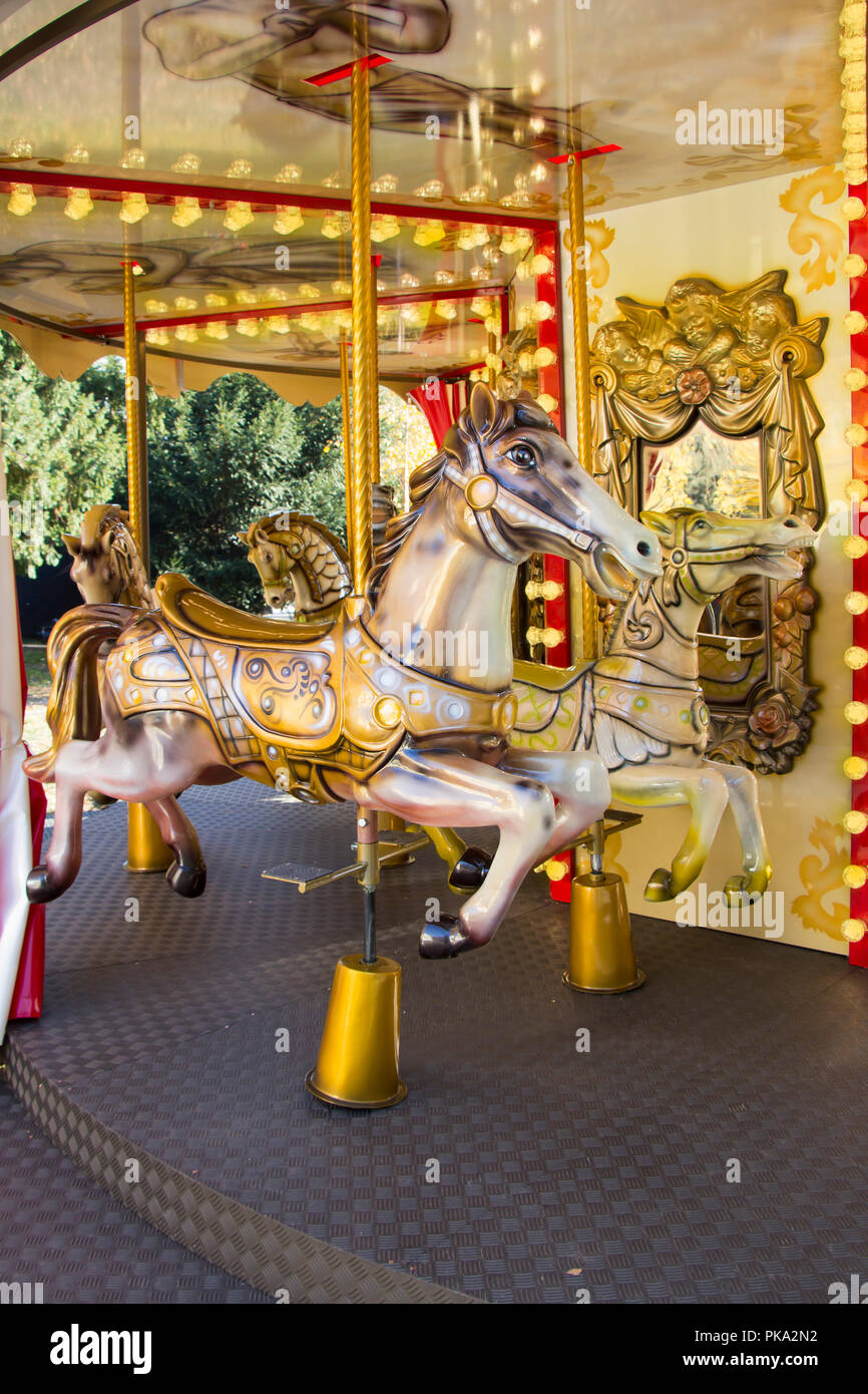 Old fashioned french carousel with horses Stock Photo - Alamy