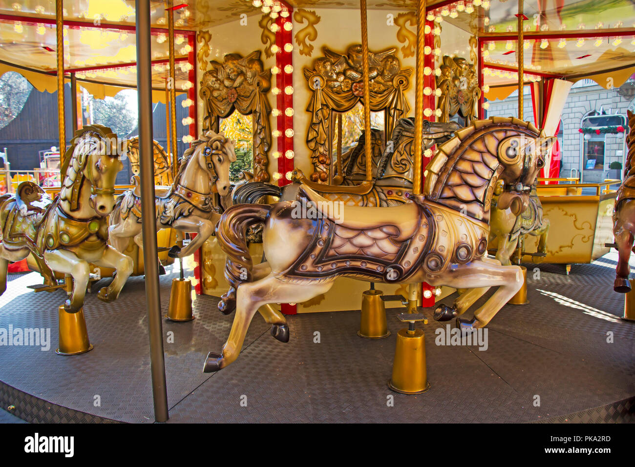 Old fashioned french carousel with horses Stock Photo - Alamy