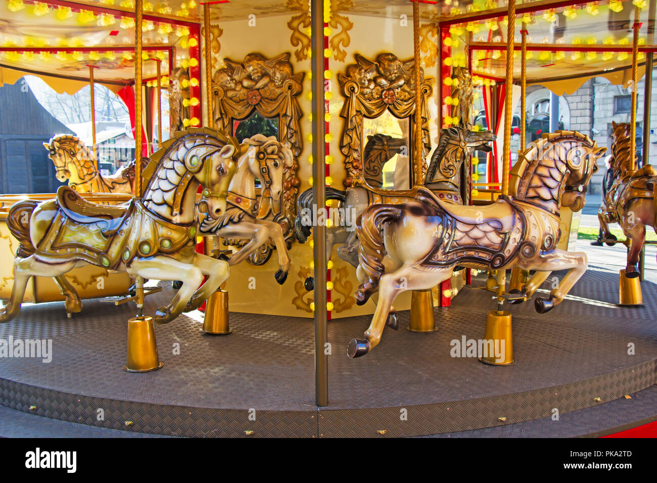 Old fashioned french carousel with horses Stock Photo - Alamy